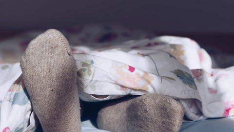 The Comfort and Benefits of Sleeping in Socks – GoWith